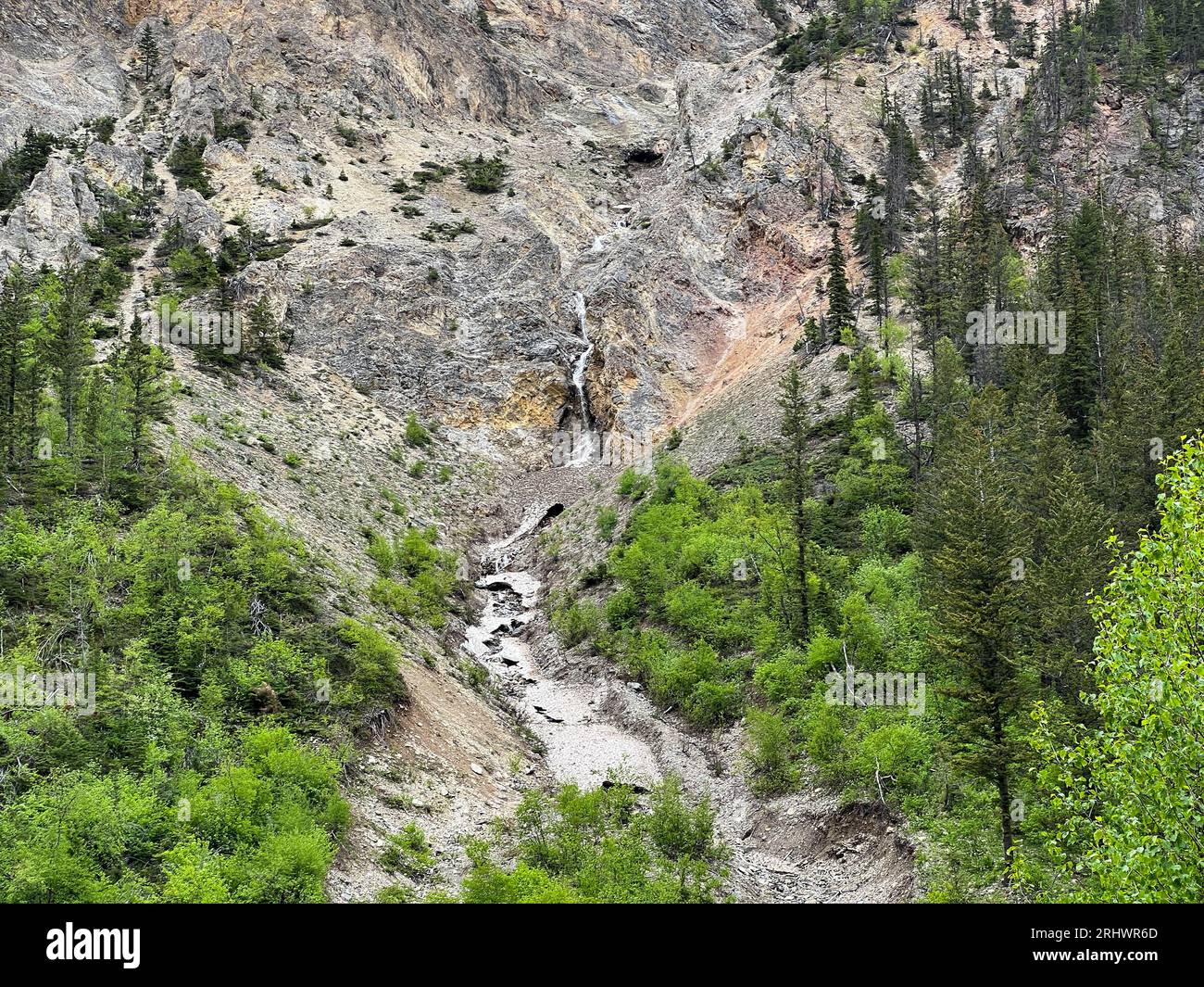 The beautiful scenic view of a waterfall in Kicking Horse Campgraound ...
