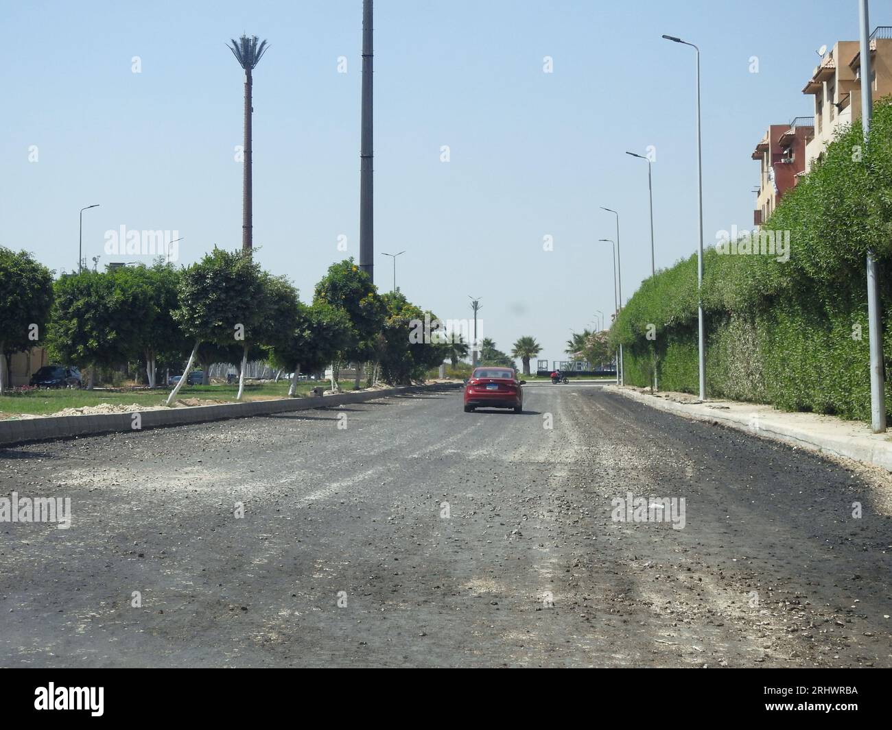 Cairo, Egypt, July 21 2023: the process of paving a road and making ...