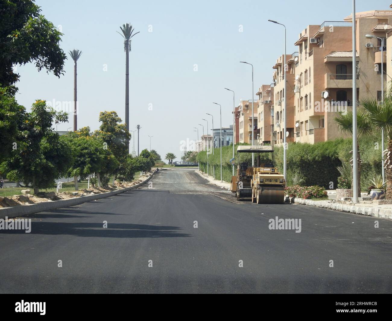 Cairo, Egypt, July 21 2023: the process of paving a road and making ...