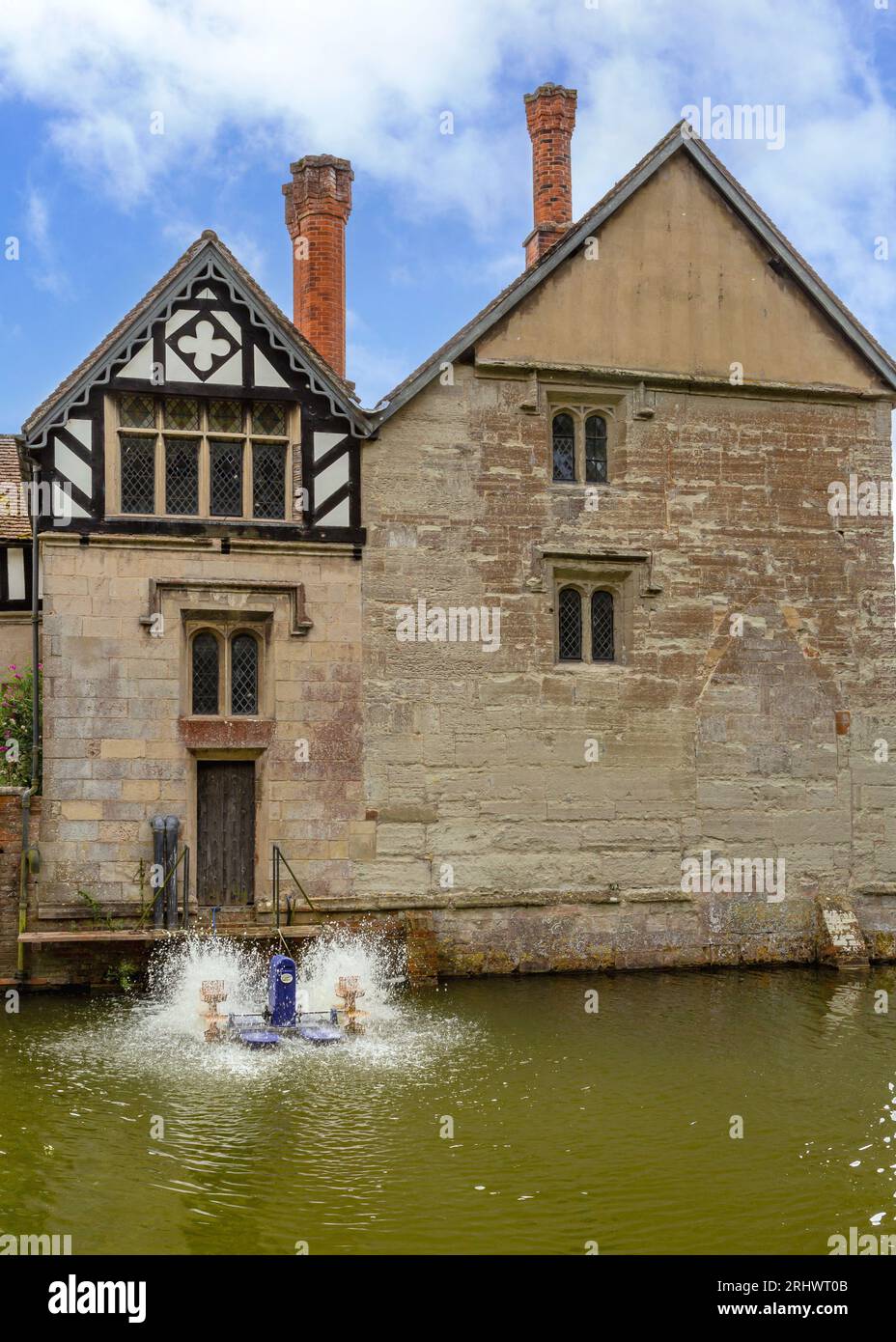 The moated Manor House and grounds in Baddesley Clinton, Warwickshire ...