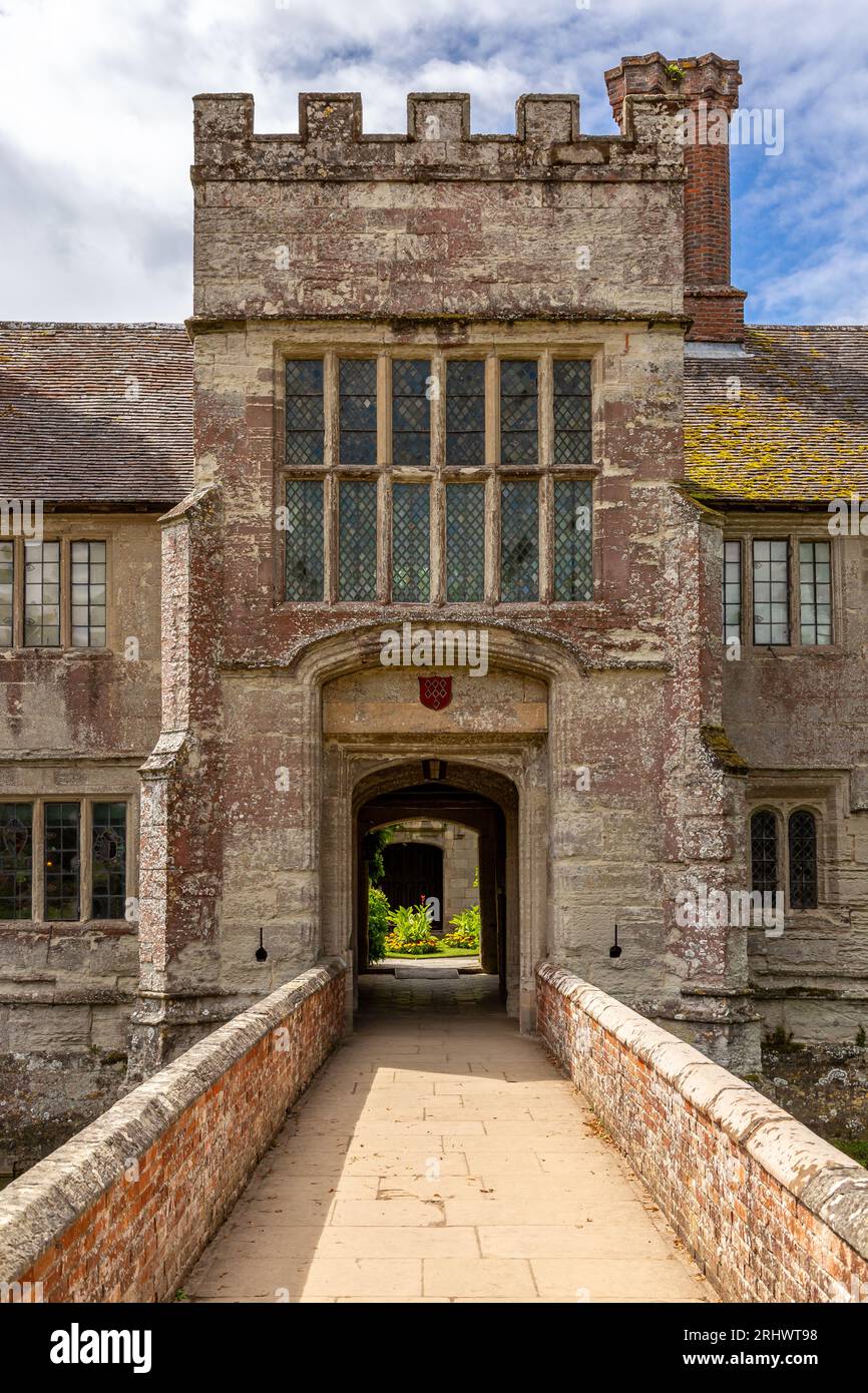 The moated Manor House and grounds in Baddesley Clinton, Warwickshire ...