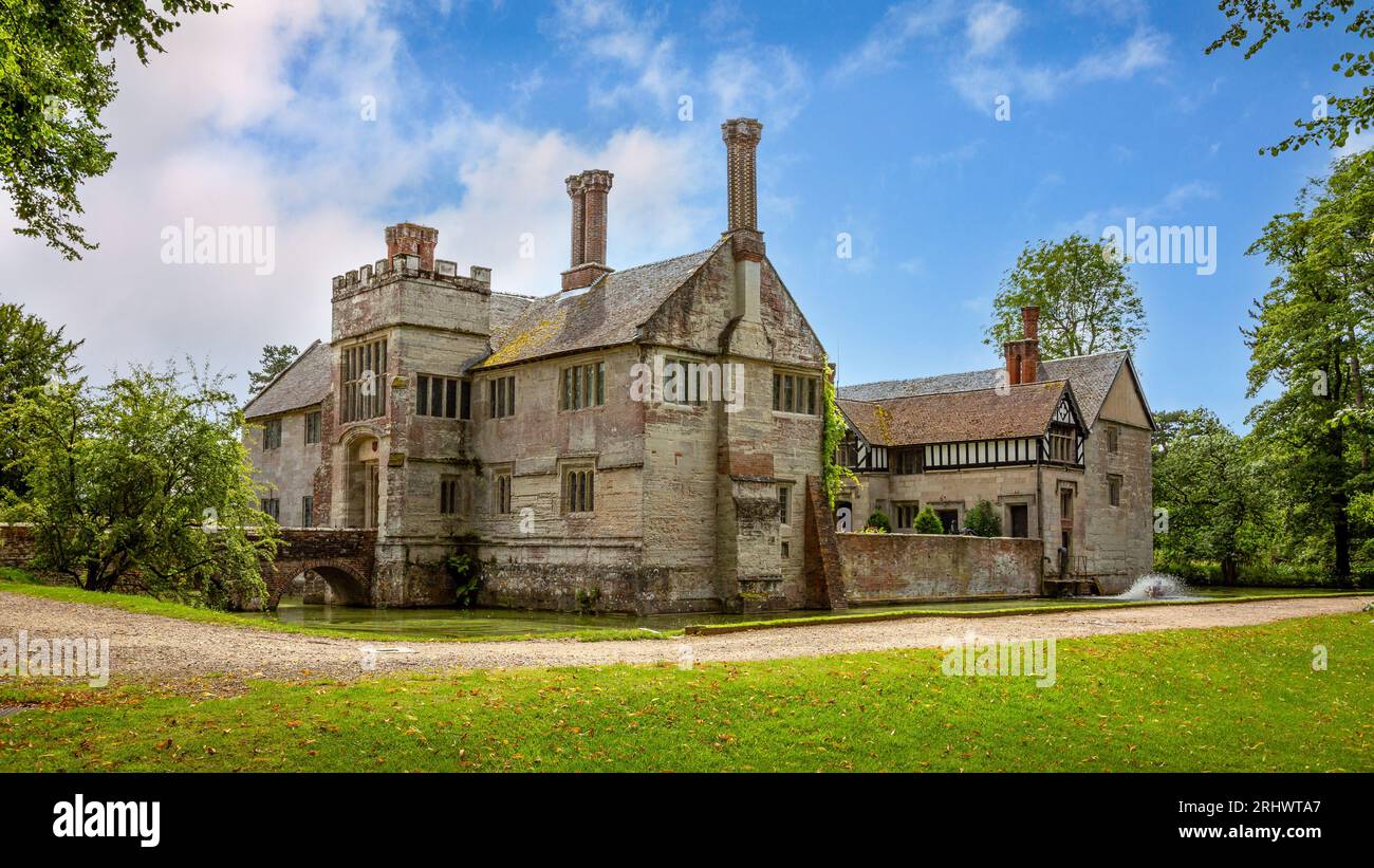 The moated Manor House and grounds in Baddesley Clinton, Warwickshire ...