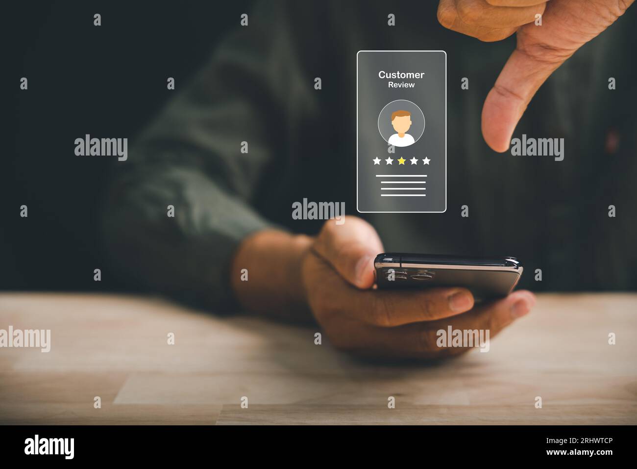 Unhappy client holding a mobile phone, displaying a thumb down sign ...