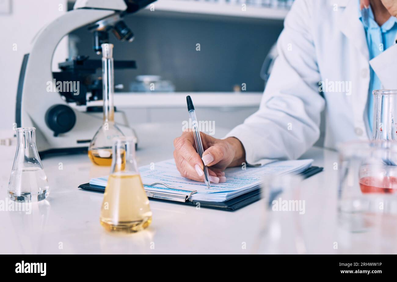 Science, hands of woman in laboratory and writing on checklist with ...