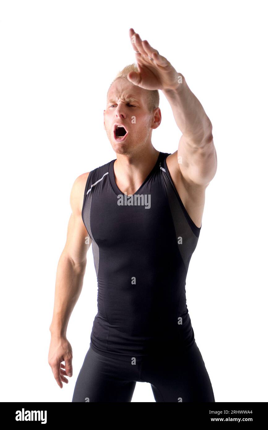 Photo of a blond man with blue eyes making a funny face in a studio ...