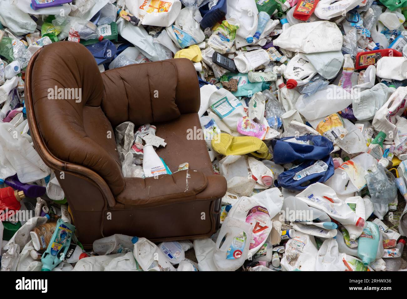16 october 2022 Almada, Portugal: old leather chair and plastic garbage ...