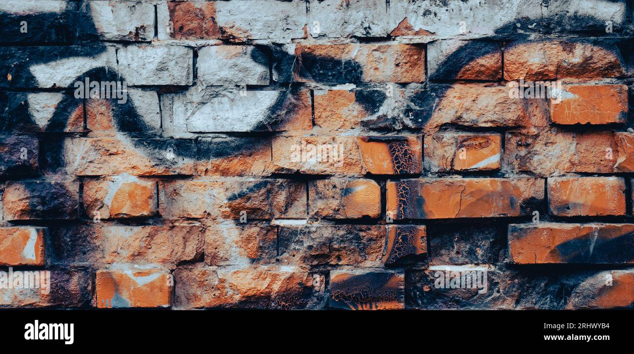 Abstract colorful fragment of graffiti paintings on old brick wall ...