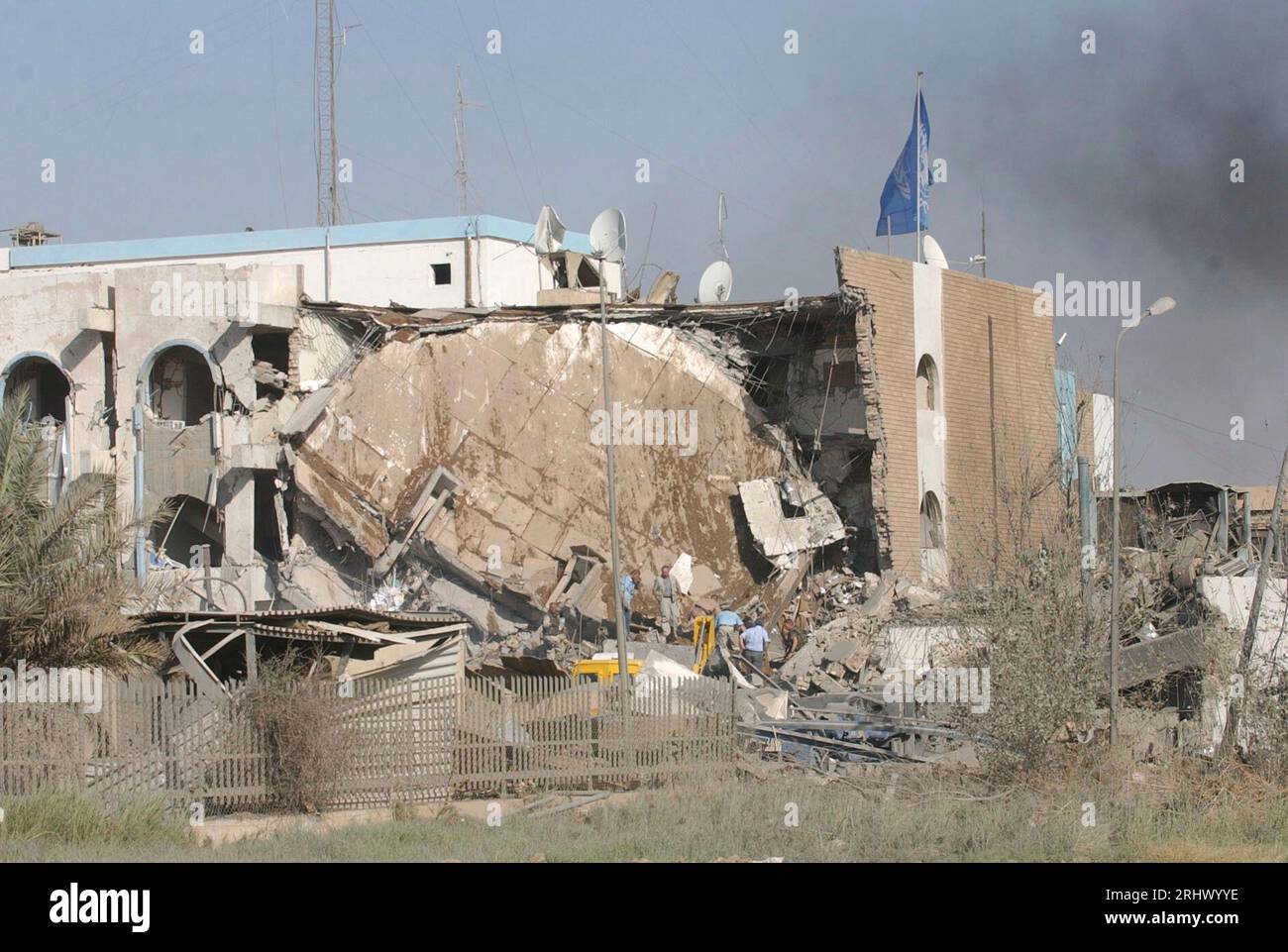 FILE - Unidentified people inspect the rubble of the al-Canal Hotel ...