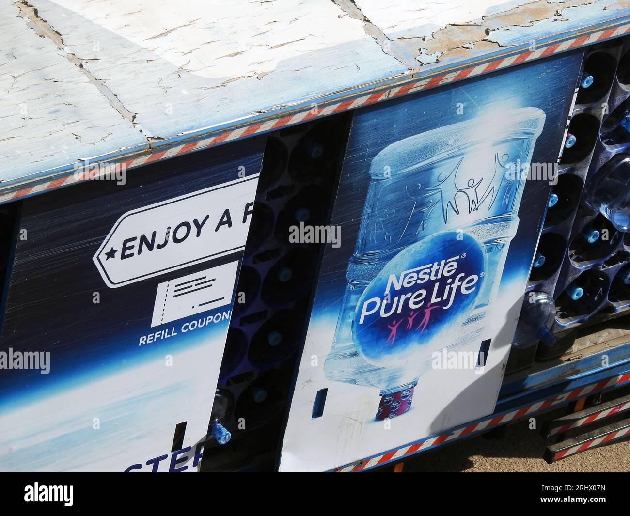 Cairo, Egypt, July 19 2023: Nestle pure Life plastic bottles delivery vehicle, Nestlé S.A., a ...