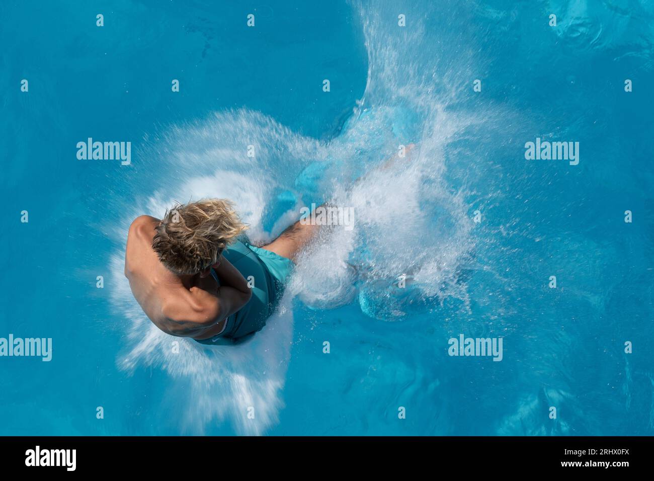 Dresden, Germany. 19th Aug, 2023. A boy jumps into the water from the 5 ...