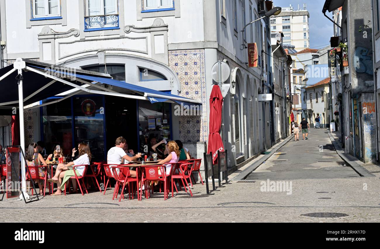 Restaurant “Cafe Central” Aveiro with customers eating outside along ...