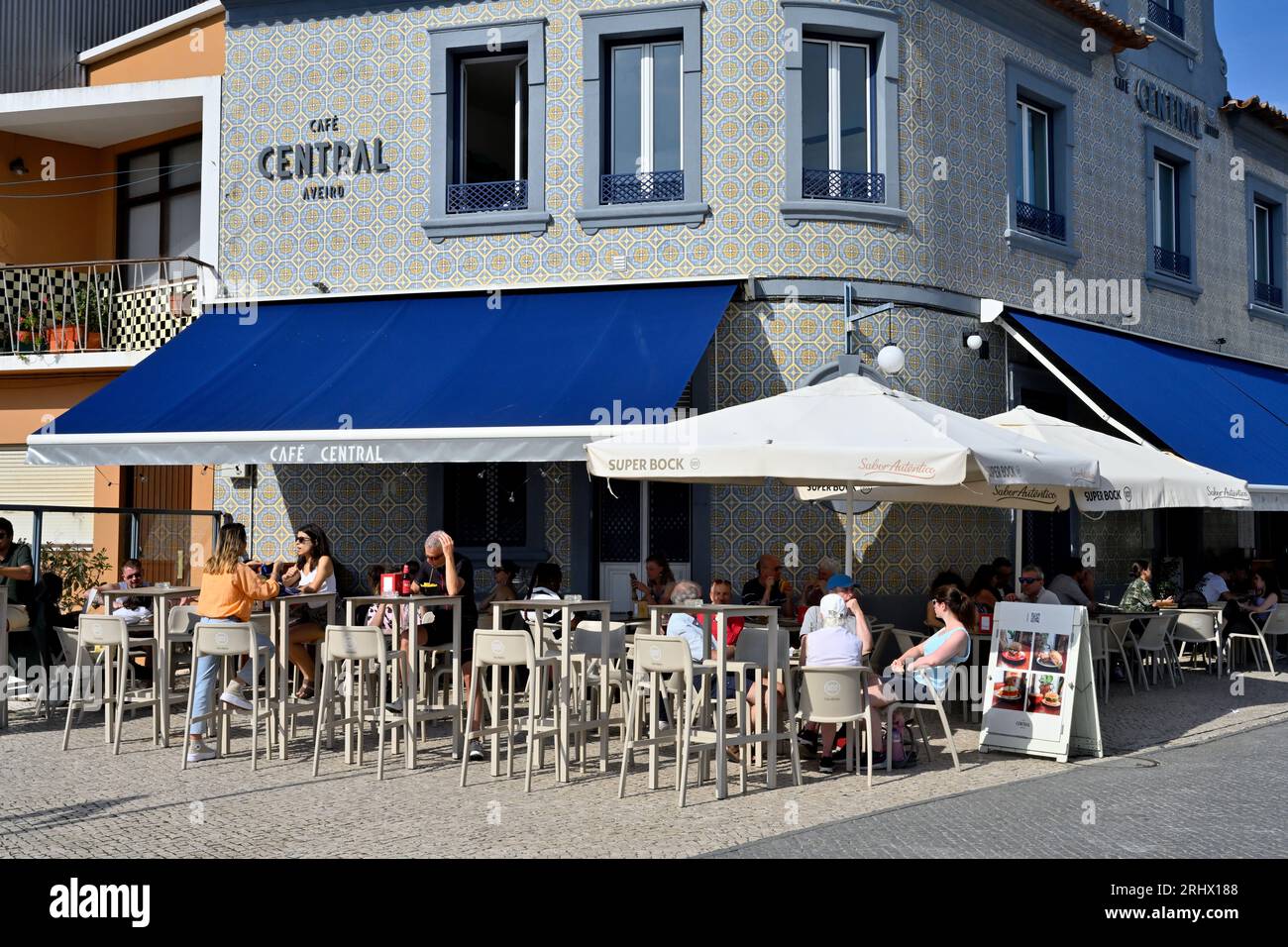 Restaurant “Cafe Central” Aveiro with customers eating outside along ...