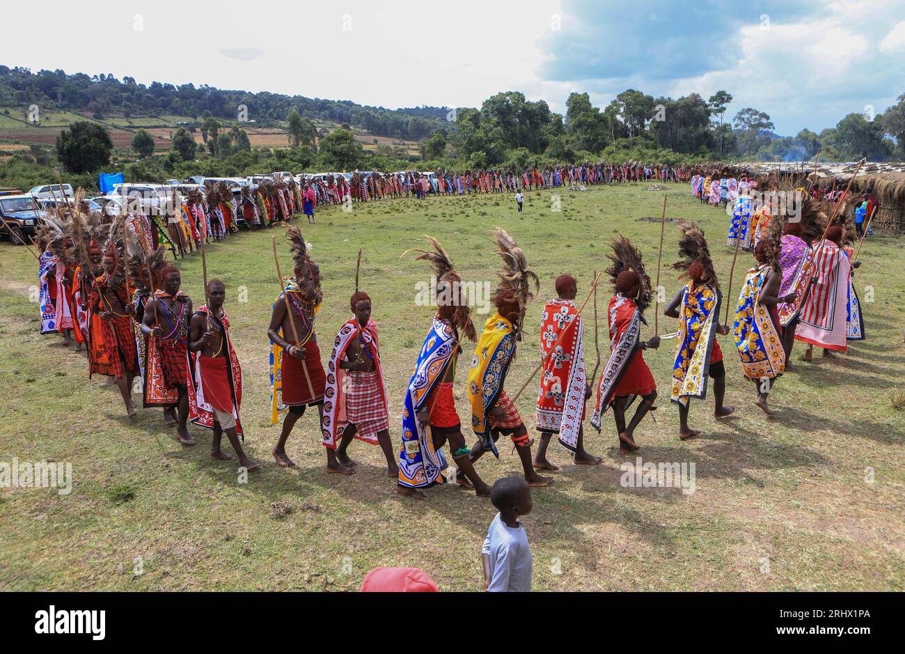 Maasai participants with traditional regalia walk during a Eunoto ...
