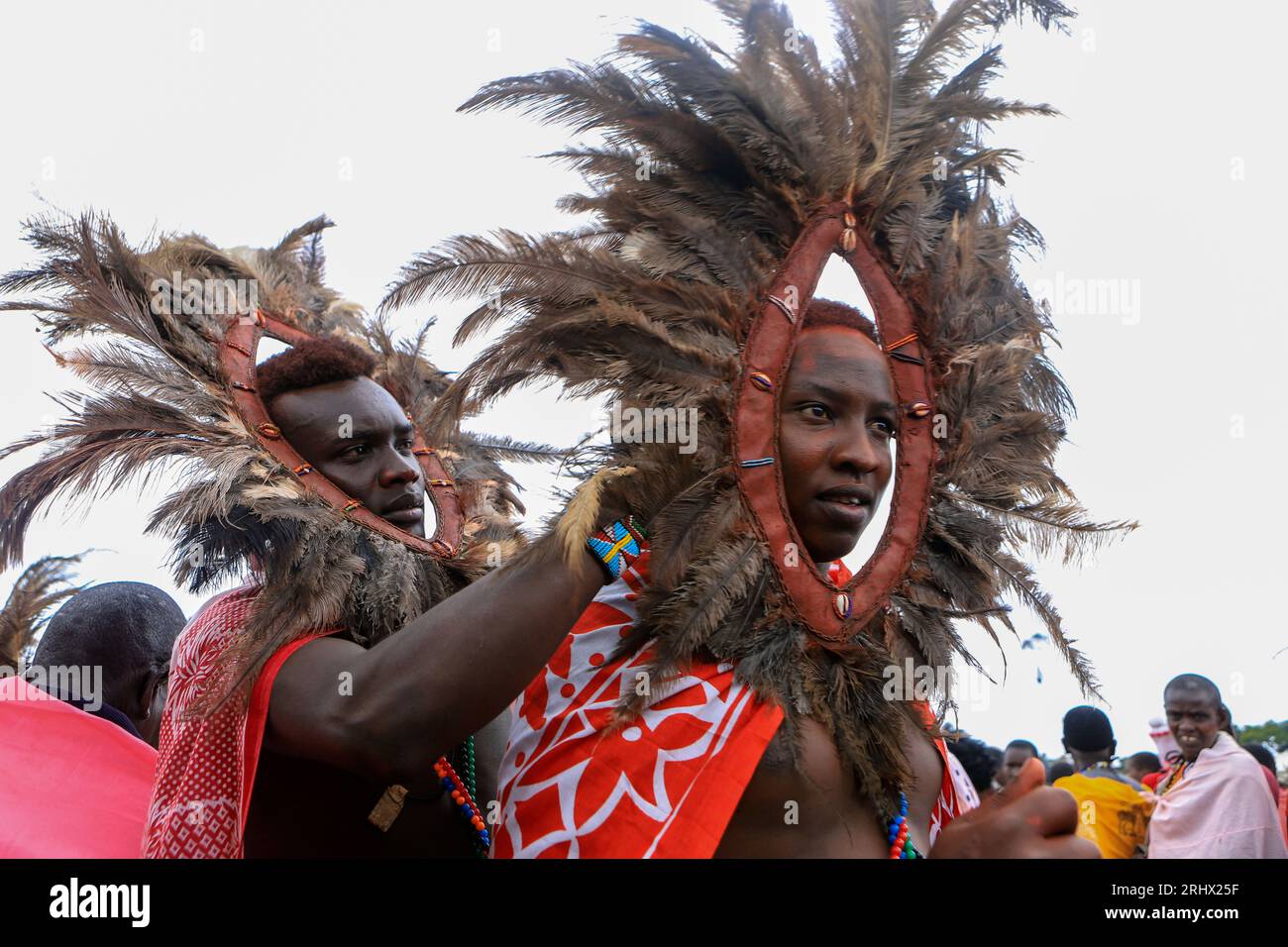 Maasai participants with traditional regalia walk during a Eunoto ...