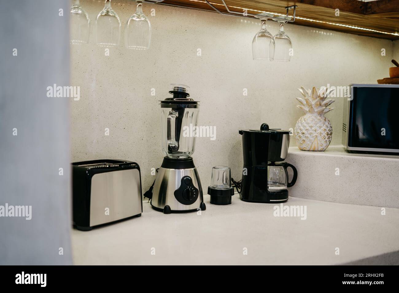 Modern luxury white kitchen in high tech style. Stainless steel toaster ...