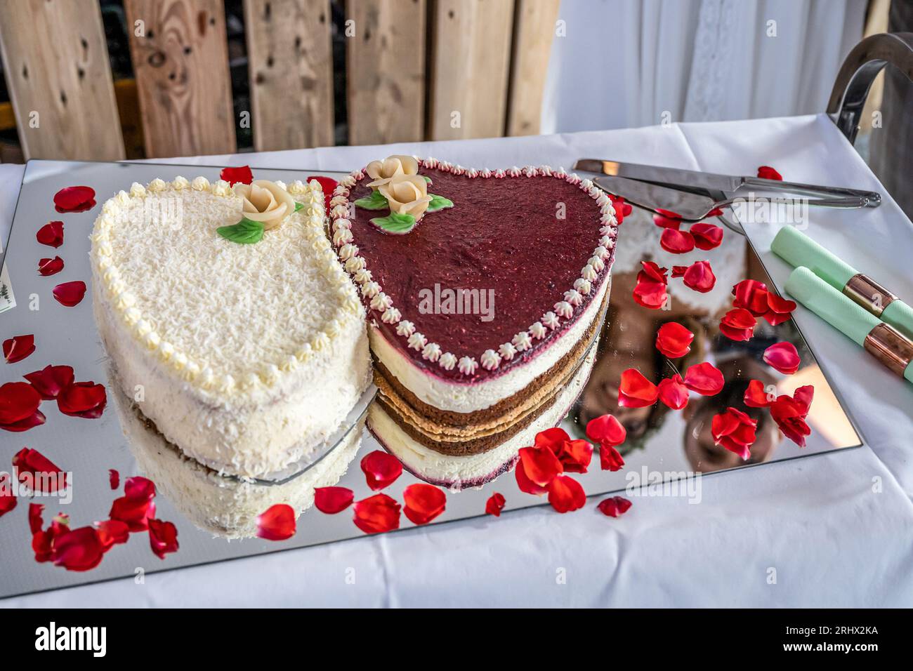 Romantic wedding Two cakes in heart shape, roses bouquet on white table ...