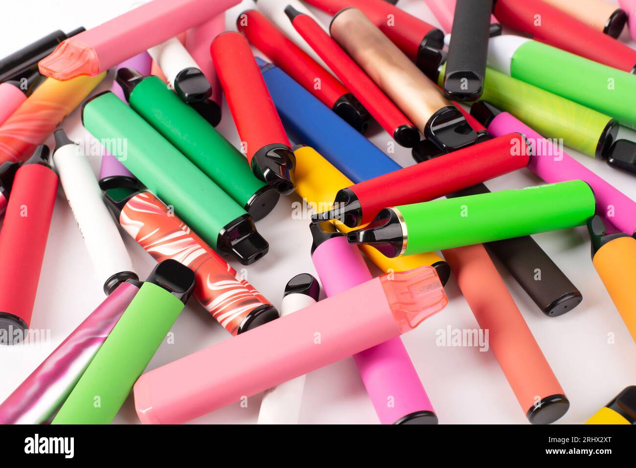 Set of colorful disposable electronic cigarettes of different shapes on ...