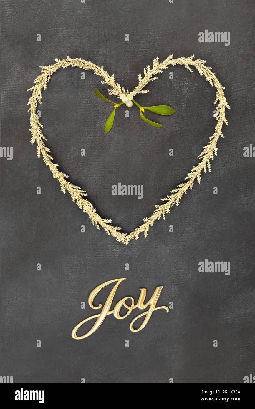 Christmas joy sign, gold tinsel heart shape wreath with mistletoe sprig ...