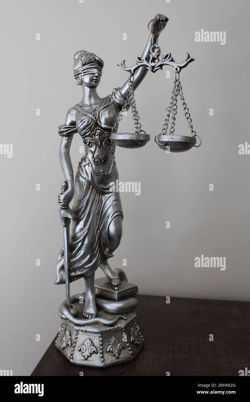 Statue of a woman symbolizing justice and law. justice and scales Stock ...
