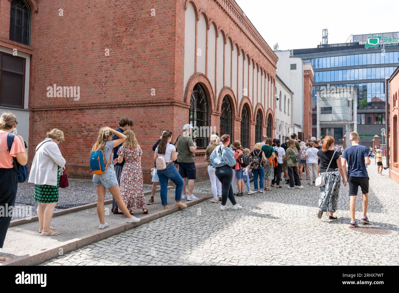 Warsaw, Poland - August 1, 2023. Lots of people are queuing outside to ...