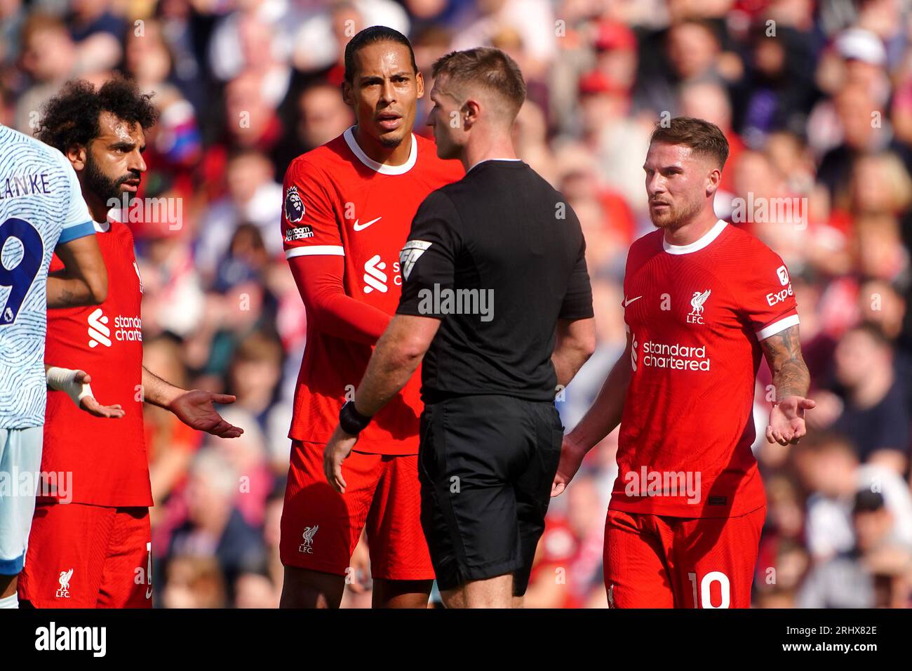 Liverpool's Alexis Mac Allister (right) reacts after being shown a red ...
