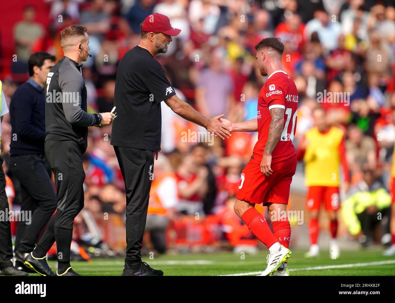 Liverpool's Alexis Mac Allister (right) is acknowledged by manager ...
