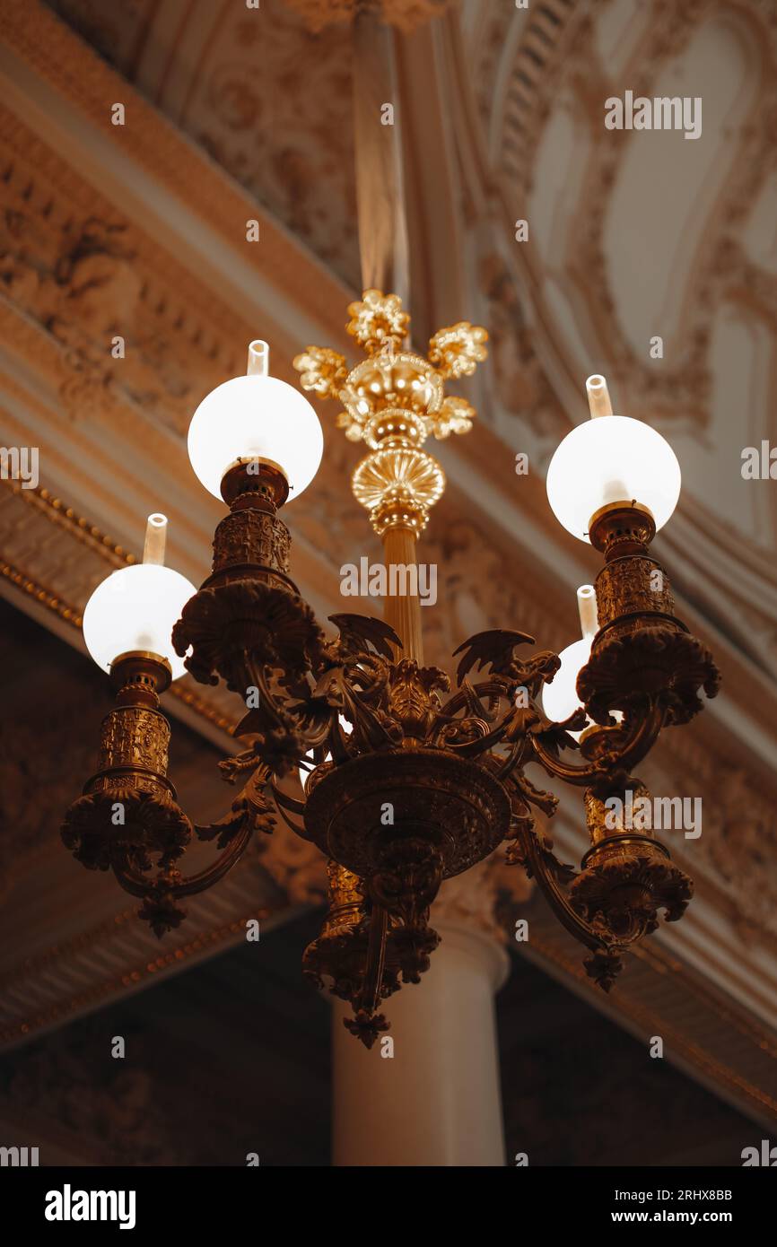 Vintage historical golden royal metallic chandelier.Historical Details ...