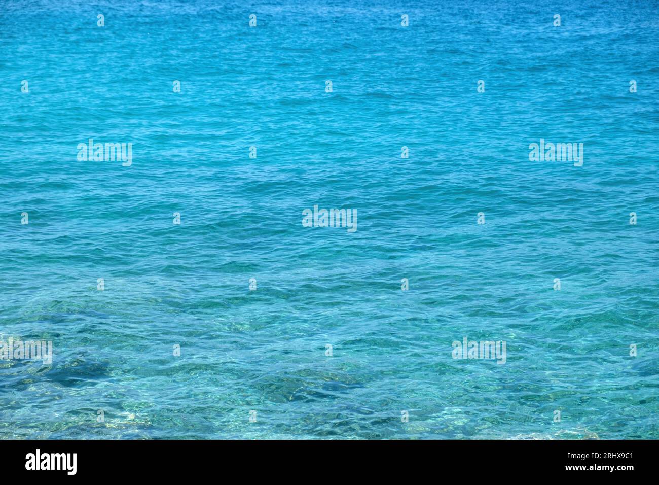 Rippled wavy transparent sea background texture, close up view. Deep ...
