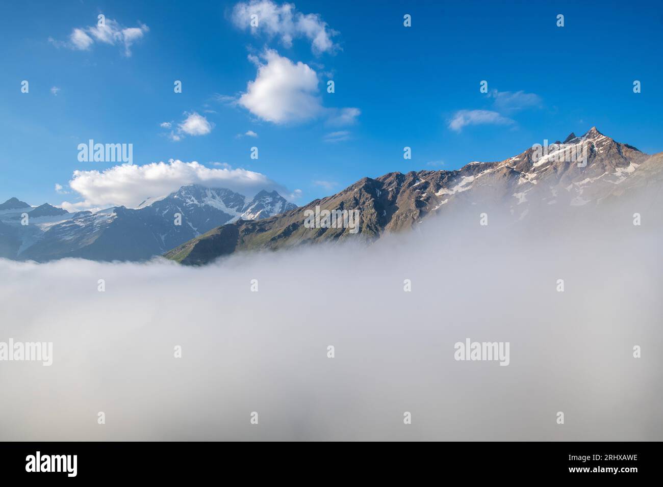 Beautiful morning landscape with fog and mountains Stock Photo - Alamy