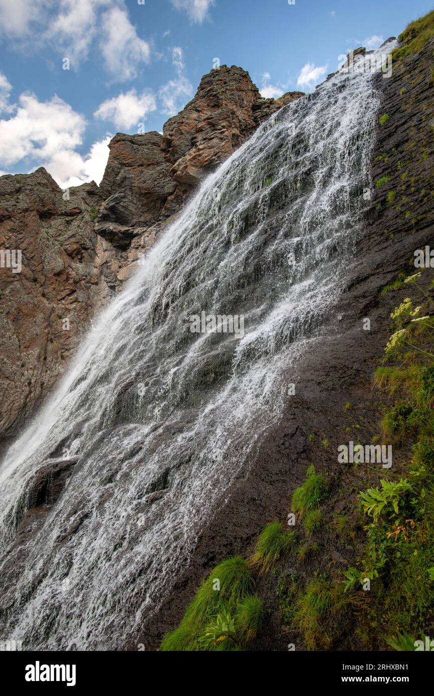 Beautiful photo with a mountain waterfall Stock Photo - Alamy