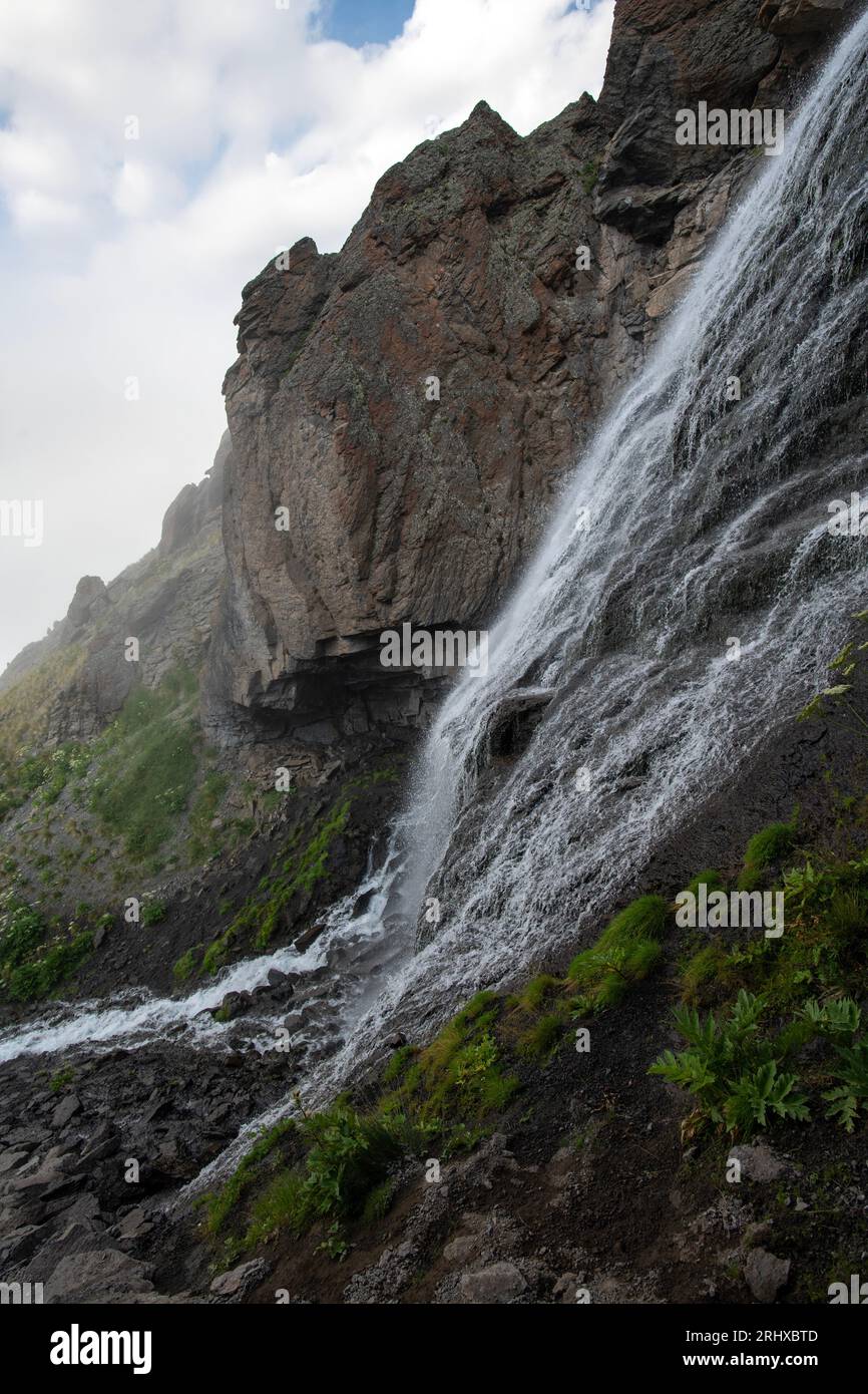 Beautiful photo with a mountain waterfall Stock Photo - Alamy