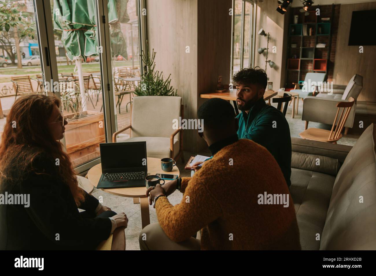 A photo of cute male business person talking sales profit with his male ...