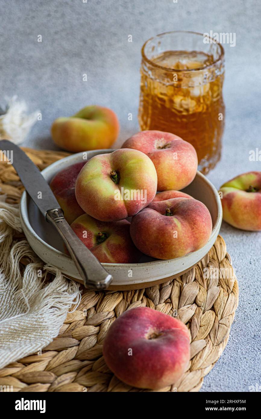High angle of plate of zodiac peach variety and summer lemonade with ...