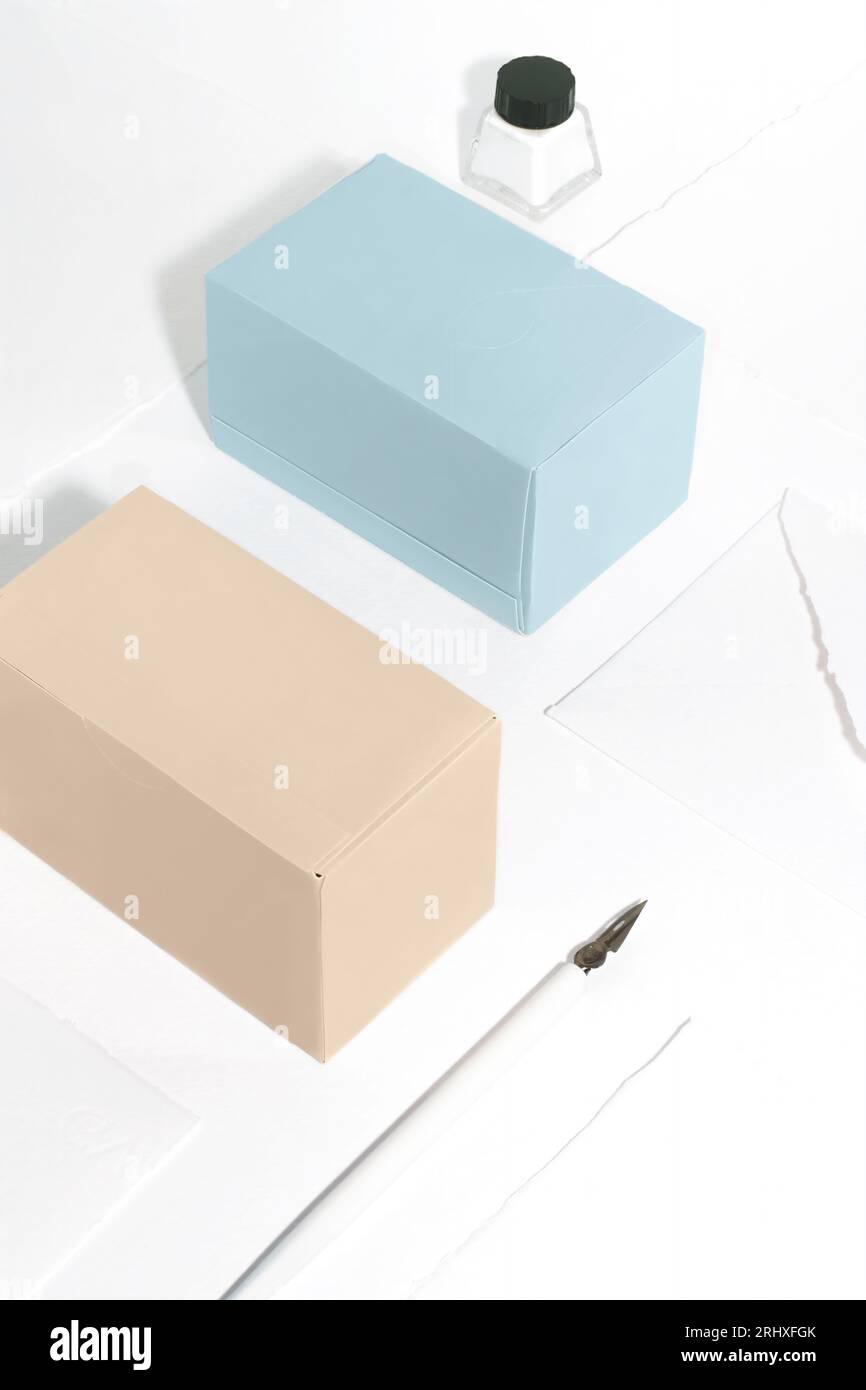 High angle of composition with tea boxes, a writing pen and ink against ...