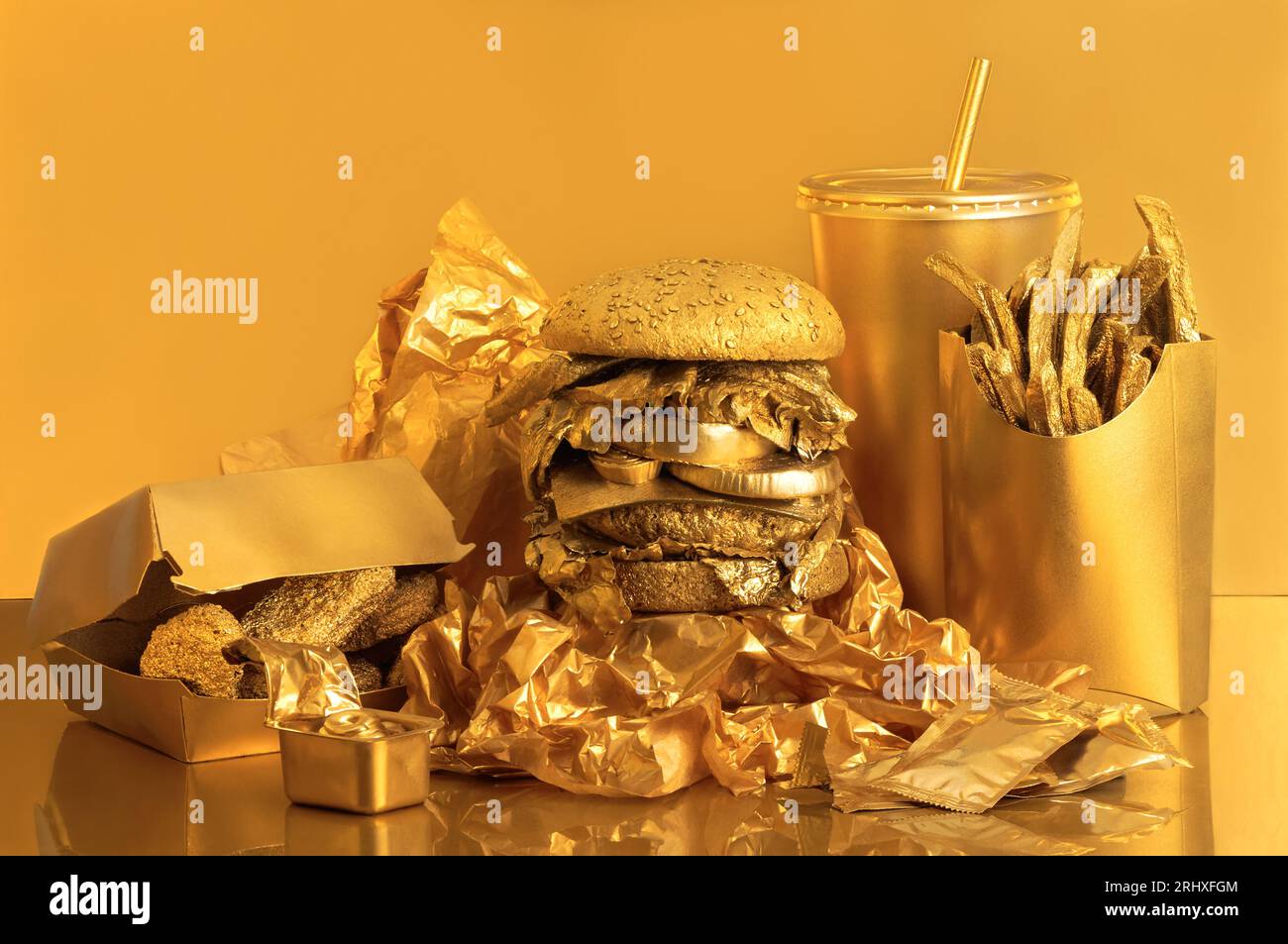 Golden street food placed on a table against a golden background Stock ...