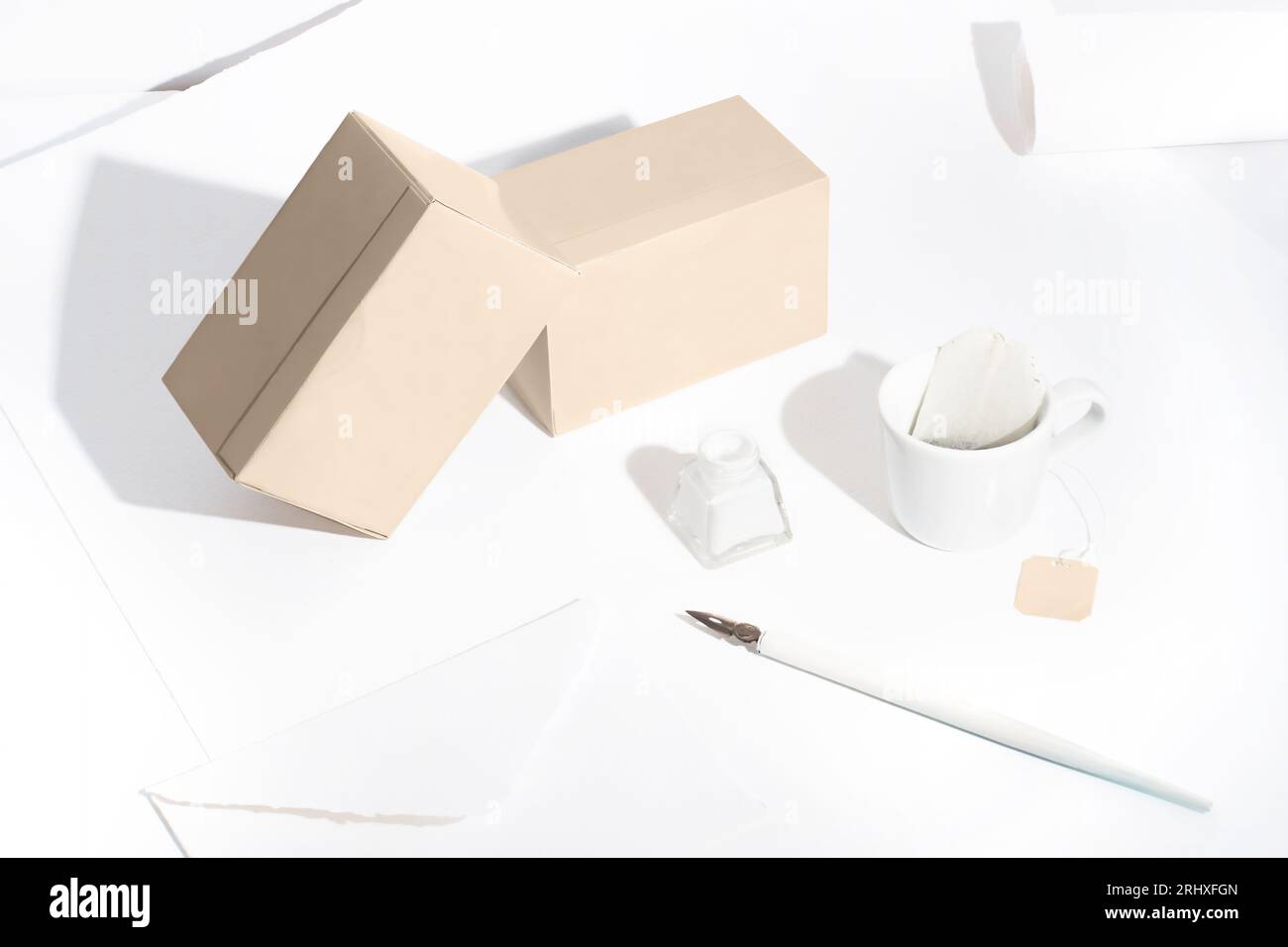 High angle of composition with tea boxes, a writing pen and ink against ...