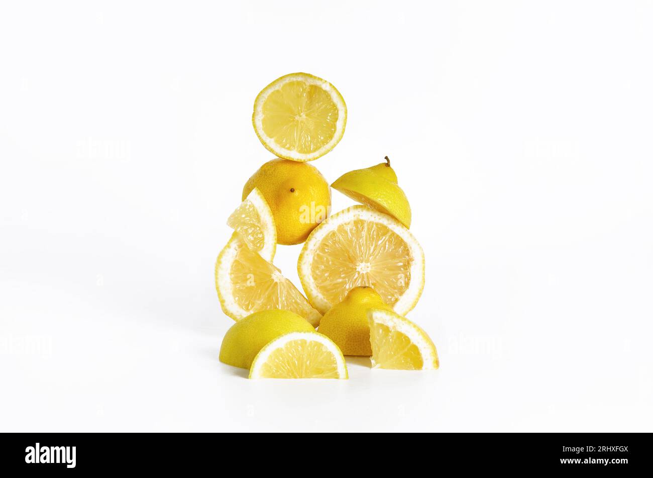 Fresh juicy sliced lemons with a white background Stock Photo - Alamy
