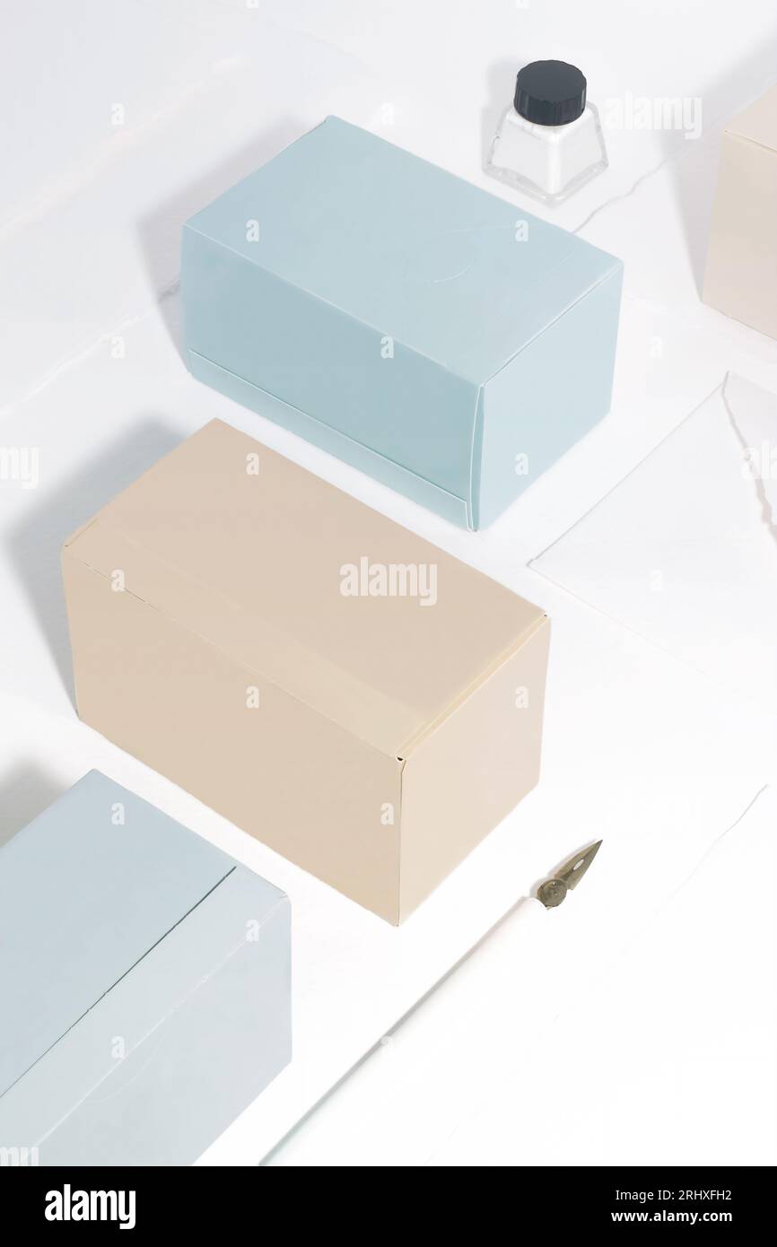 High angle of composition with tea boxes, a writing pen and ink against ...