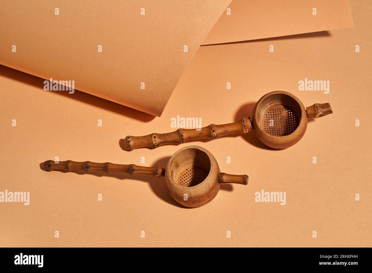 High angle of handmade bamboo tea filters near craft paper background ...