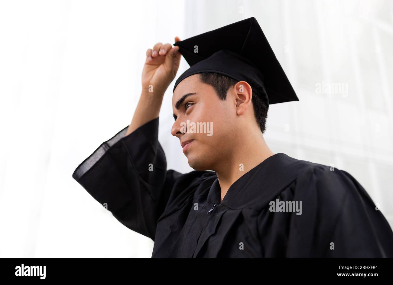 Portrait man wearing graduation cap hi-res stock photography and images ...