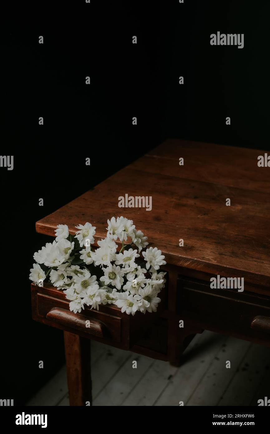 Bouquet of white blooming fragrant flowers in sets placed on wooden ...