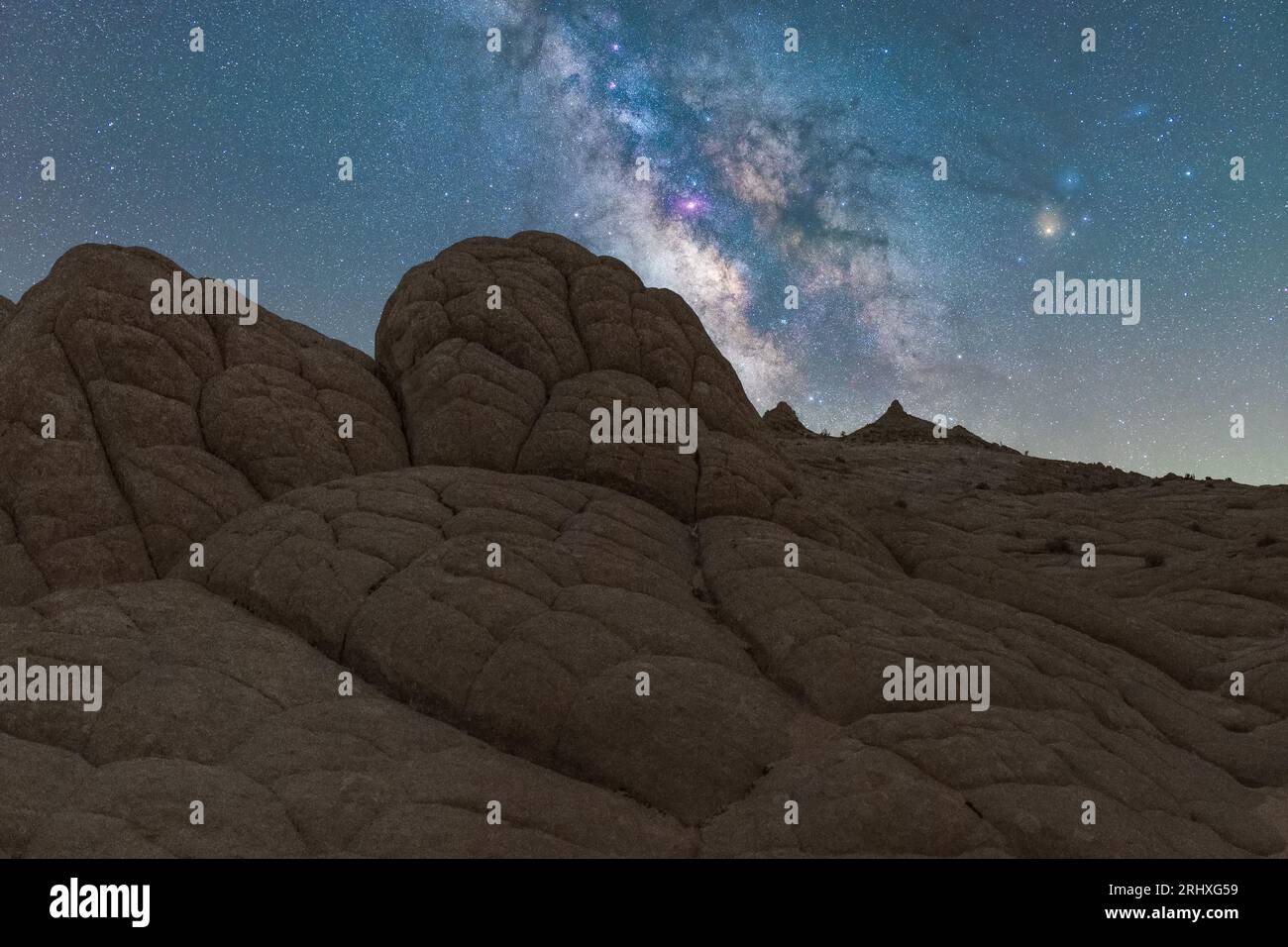 From below massive rocky formations in canyon under cloudless night ...