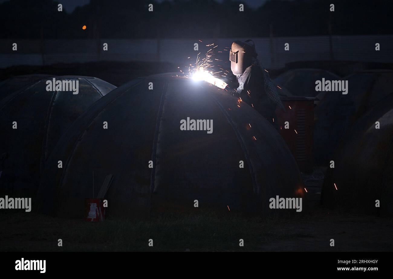Prayagraj, India. 19th August 2023, A welder constructs a pontoon of ...
