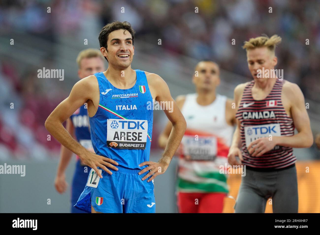 Pietro Arese, of Italy, smiles as he looks up at the scoreboard after ...