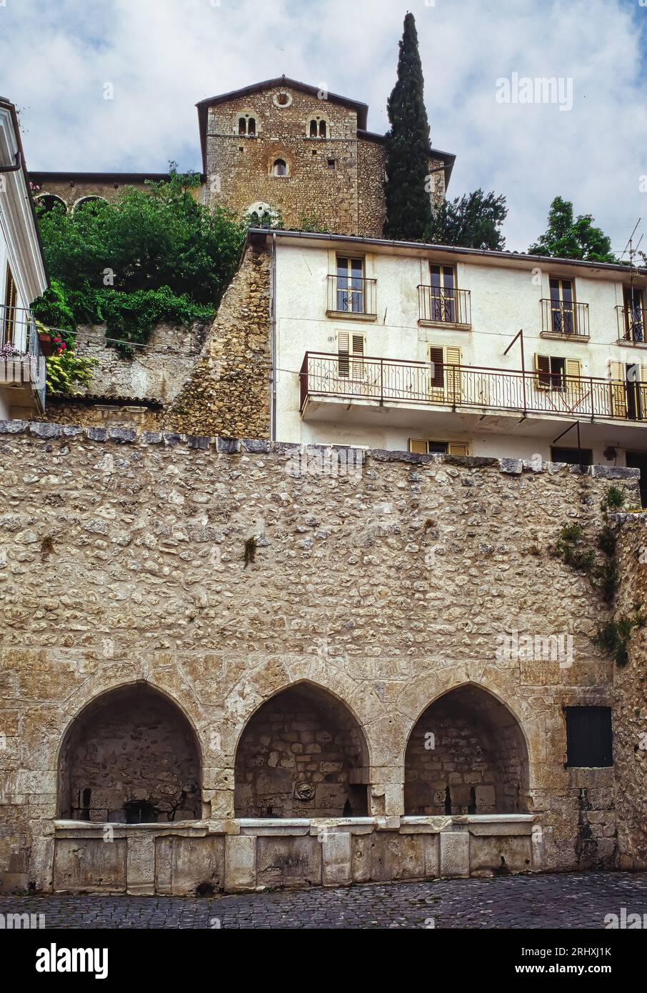 The medieval fountain with three pointed arches, in the residence ...
