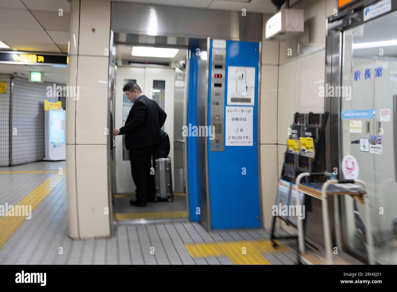 Osaka, Japan. 16th Mar, 2023. A commuter takes an elevator at the Osaka ...