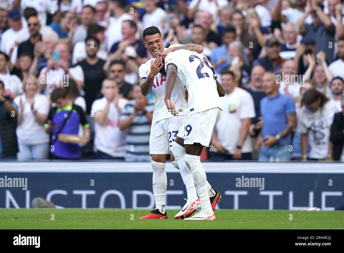 Tottenham Hotspur's Pape Matar Sarr (right) celebrates with Pedro Porro ...