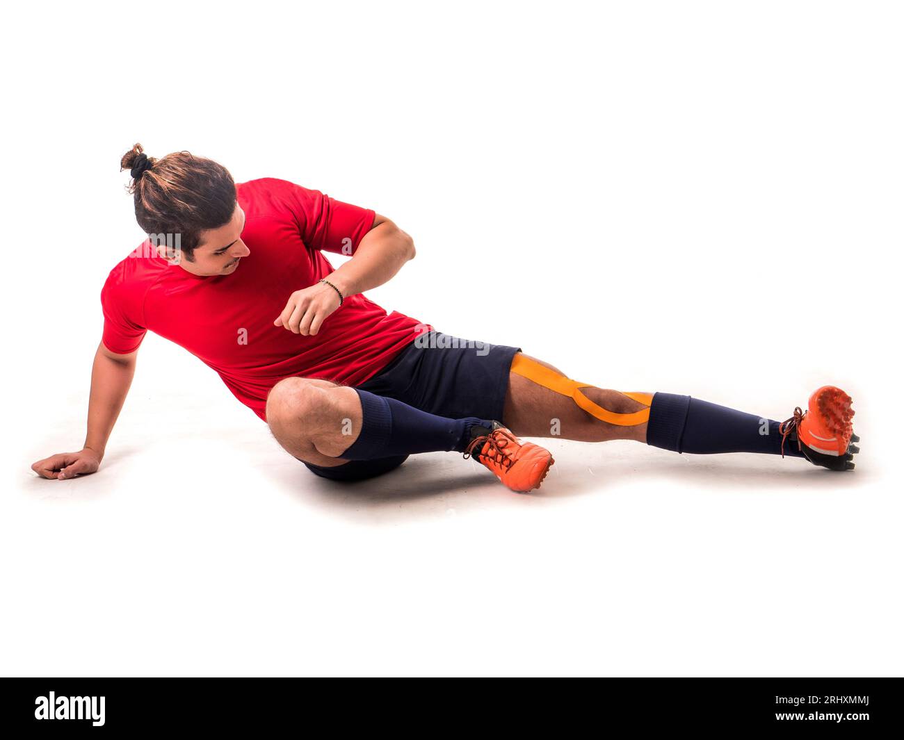 Photo of a man performing a powerful kick in a studio setting Stock ...