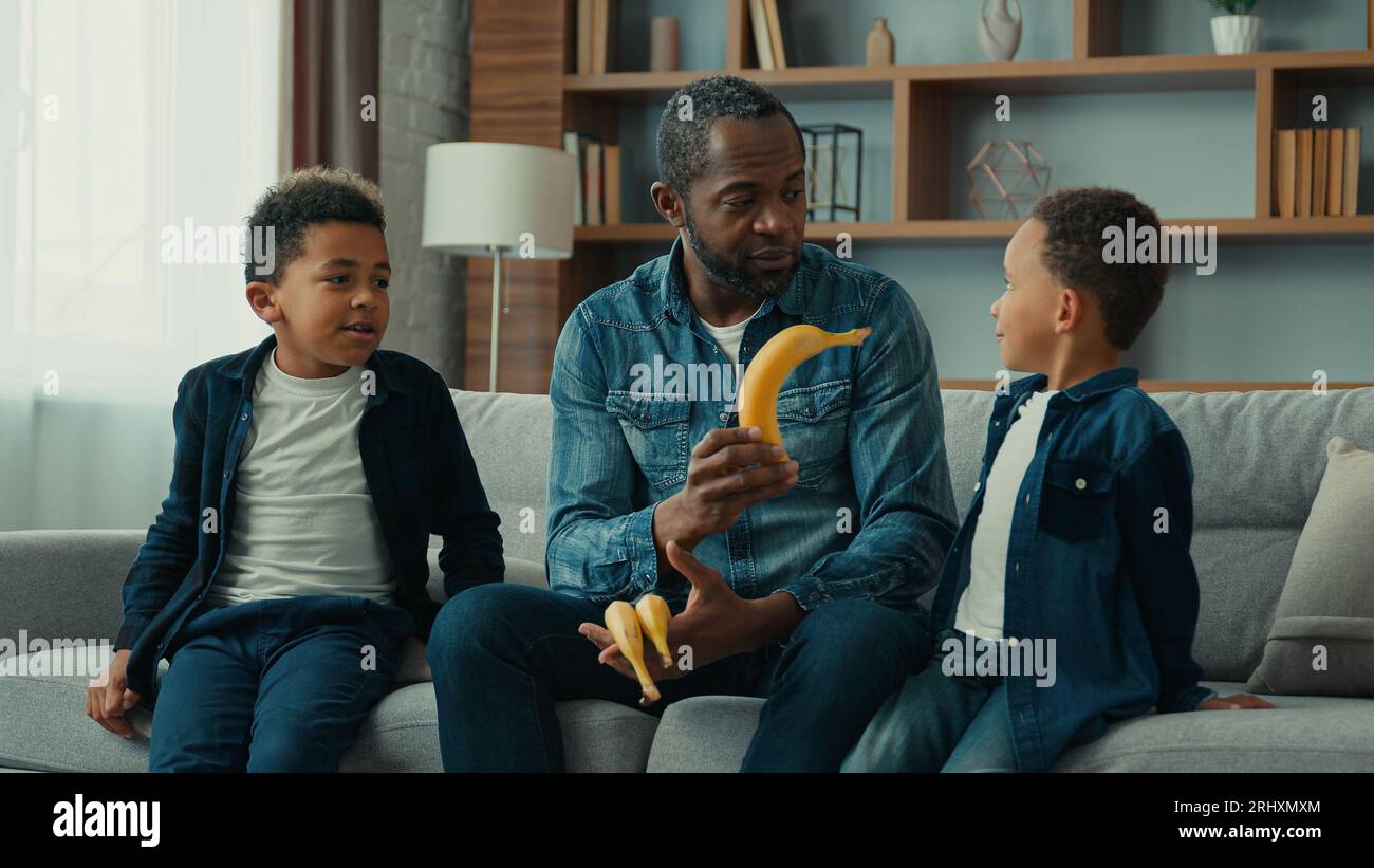 African American family at home single father man with two children ...