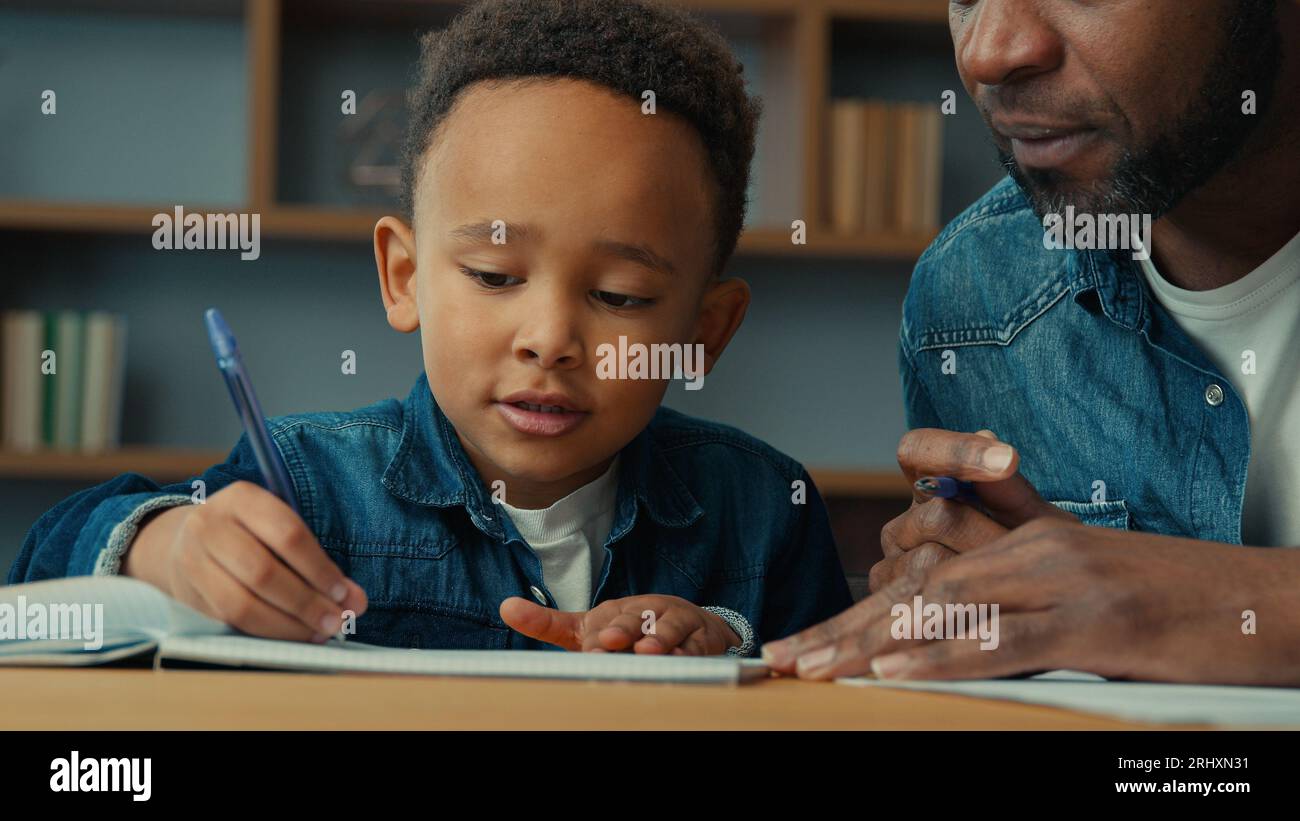 African American cute little boy child schoolboy with ethnic adult ...